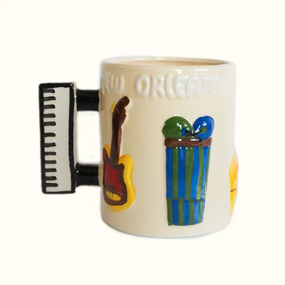 New Orleans Jazz Instruments Mug | Aunt Sally’s Pralines
